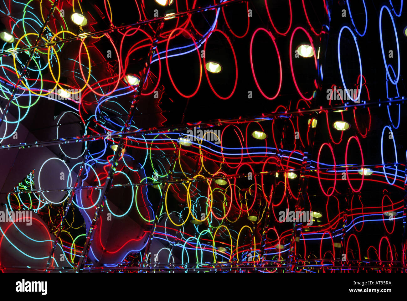 Decorative arrangement of circular neon lights in a movie theatre ...
