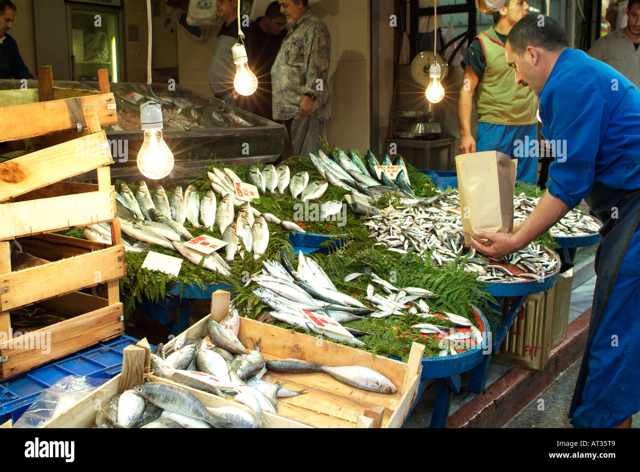 Man selling fish in bazaar hi-res stock photography and images - Alamy