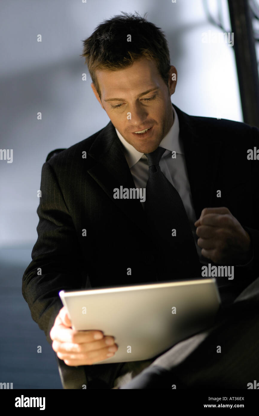 A business man using a laptop Stock Photo - Alamy