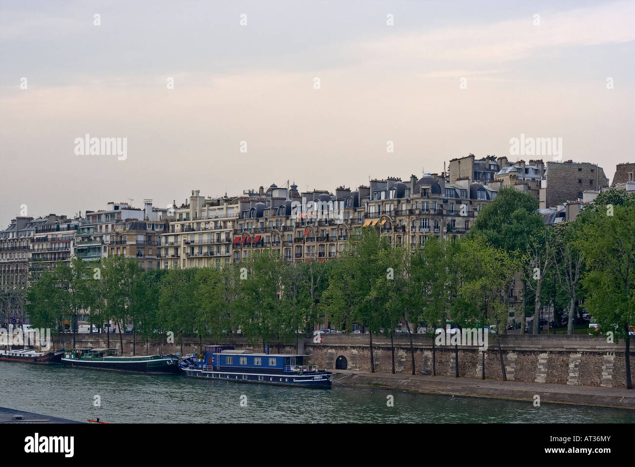Iconic view of Parisian buildings overlooking the Seine river Stock ...