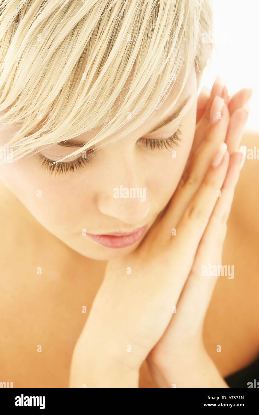 A portrait of a woman with hands to face Stock Photo - Alamy