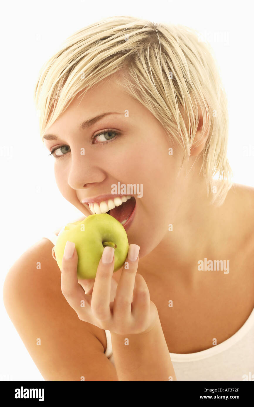 Girl taking bite apple apple hi-res stock photography and images - Alamy