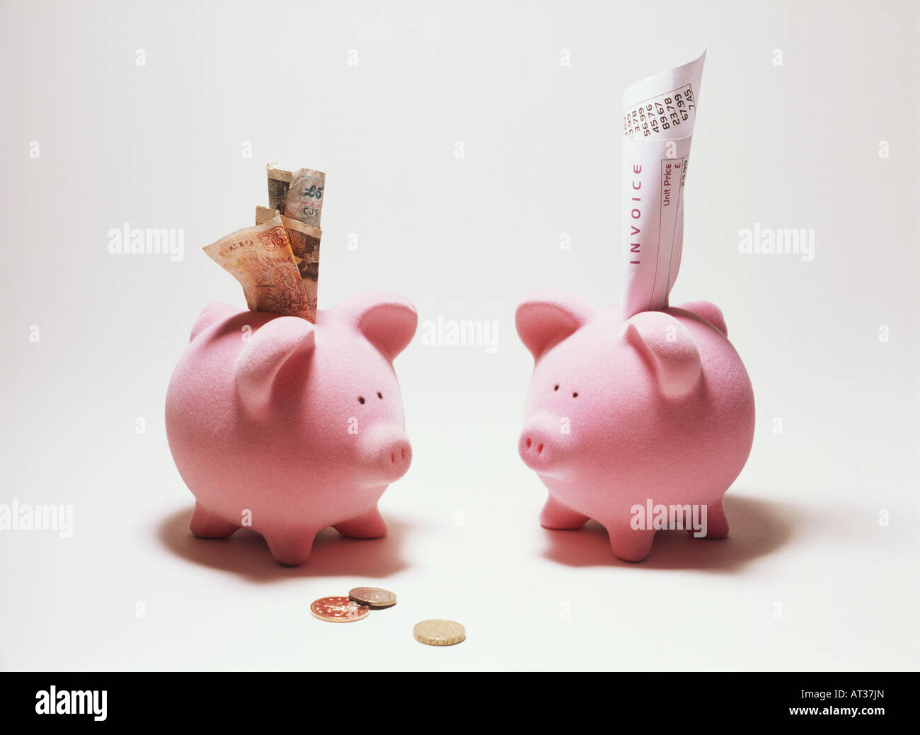 Two pink piggy banks, money and receipts Stock Photo - Alamy
