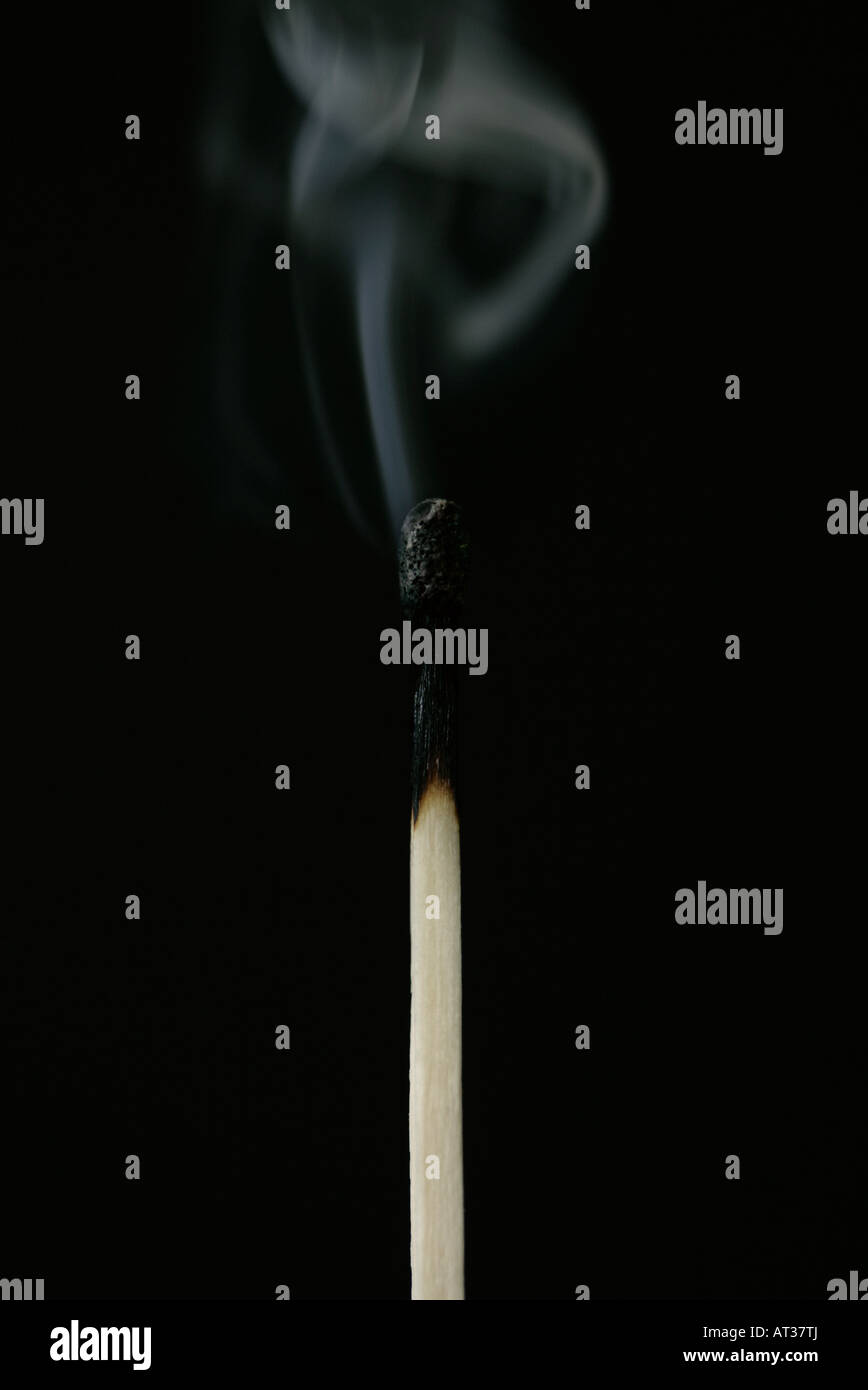 A smoking match, black background Stock Photo - Alamy