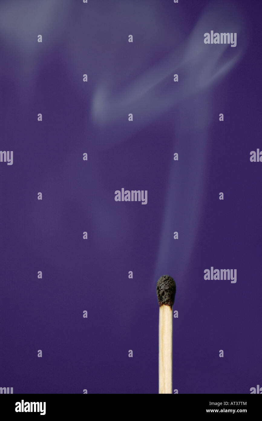 A smoking match, purple background Stock Photo - Alamy
