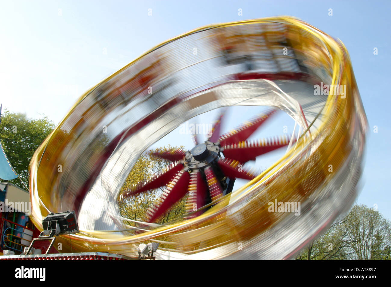 People enjoying high speed funfair ride Stock Photo - Alamy