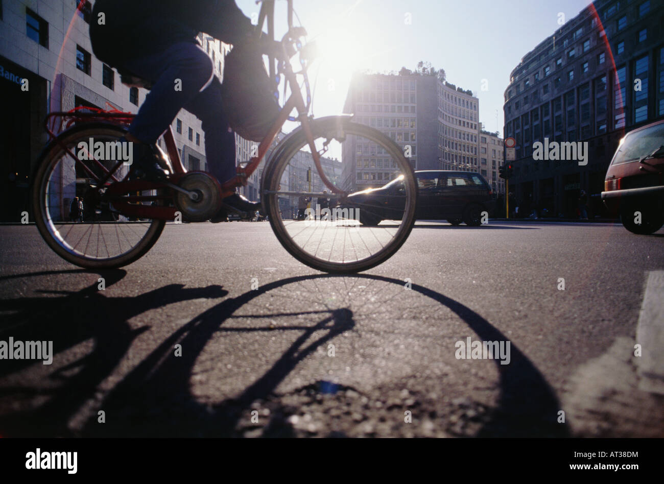 A person riding a red bike Stock Photo - Alamy