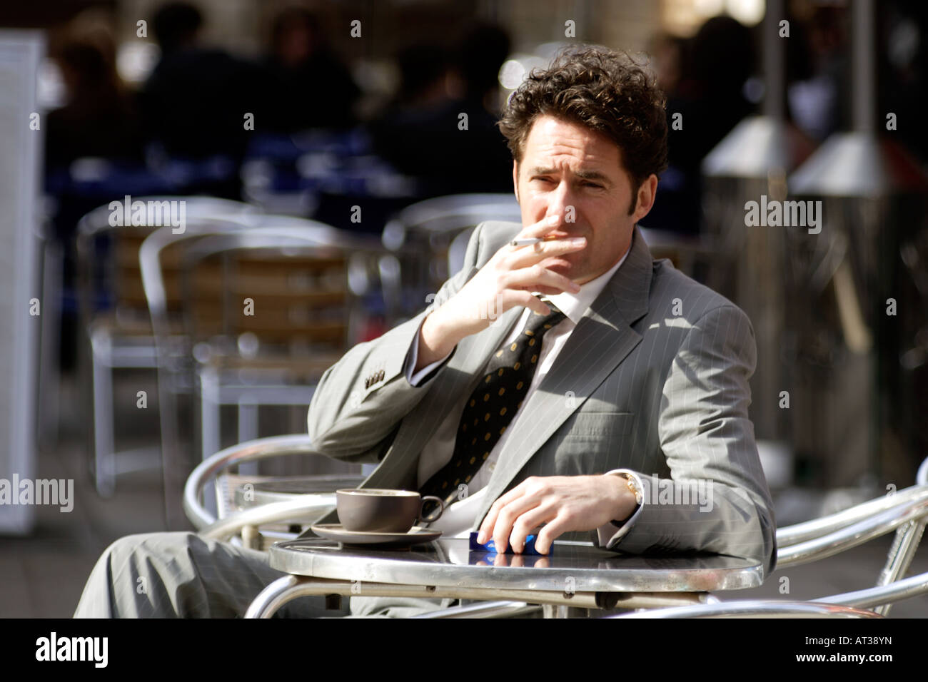 Man smoking at a cafe hi-res stock photography and images - Alamy