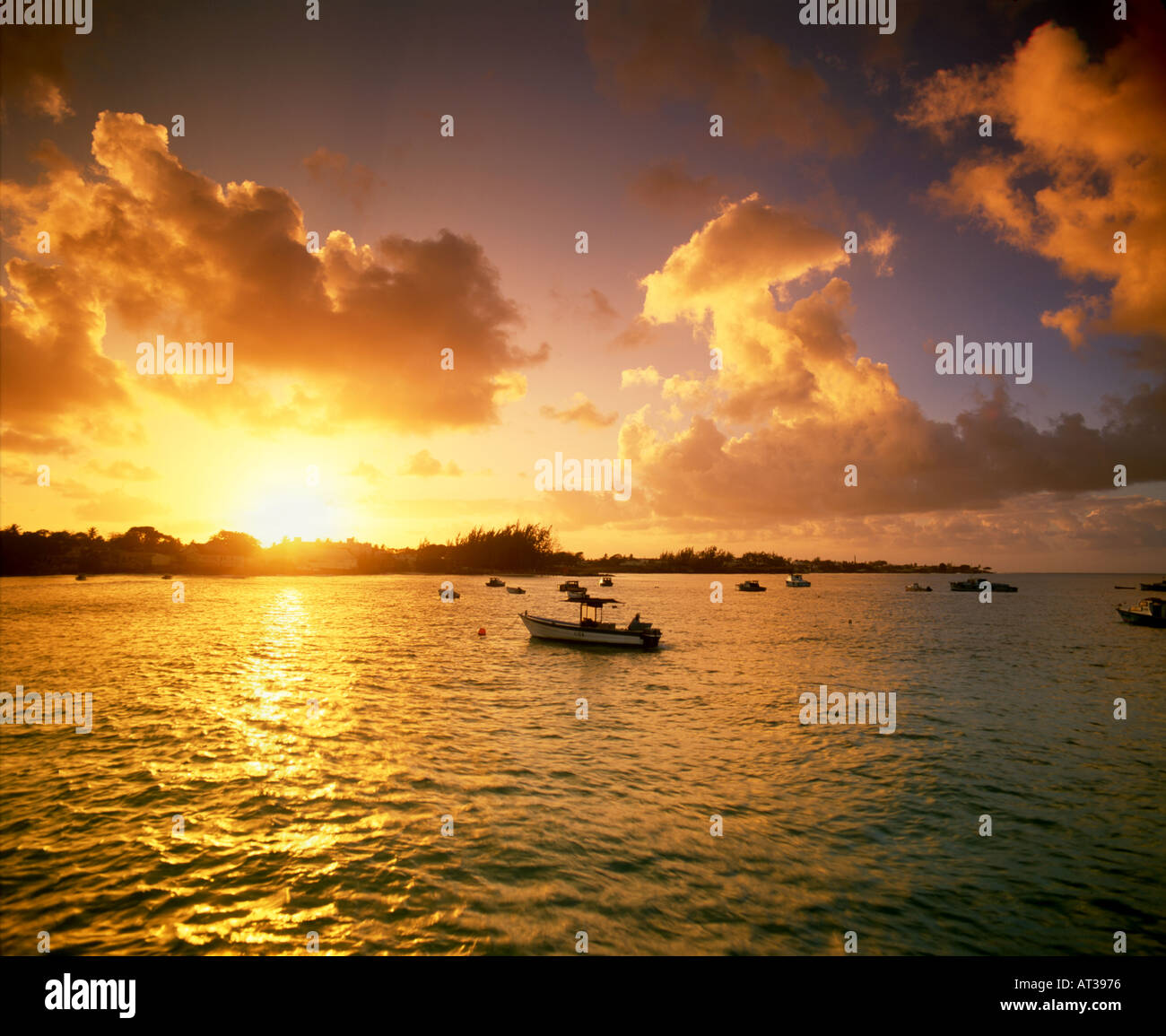Beautiful morning sunrise with boats moored in Barbados Stock Photo - Alamy