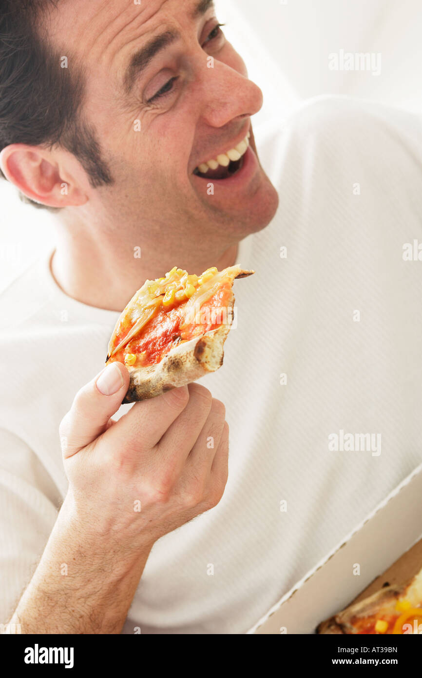 Fat man eating a pizza hi-res stock photography and images - Alamy