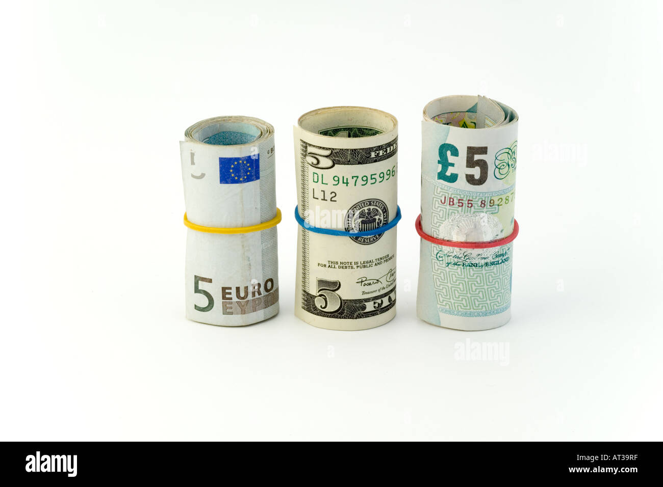 Rolls of world bank notes in a line Stock Photo - Alamy