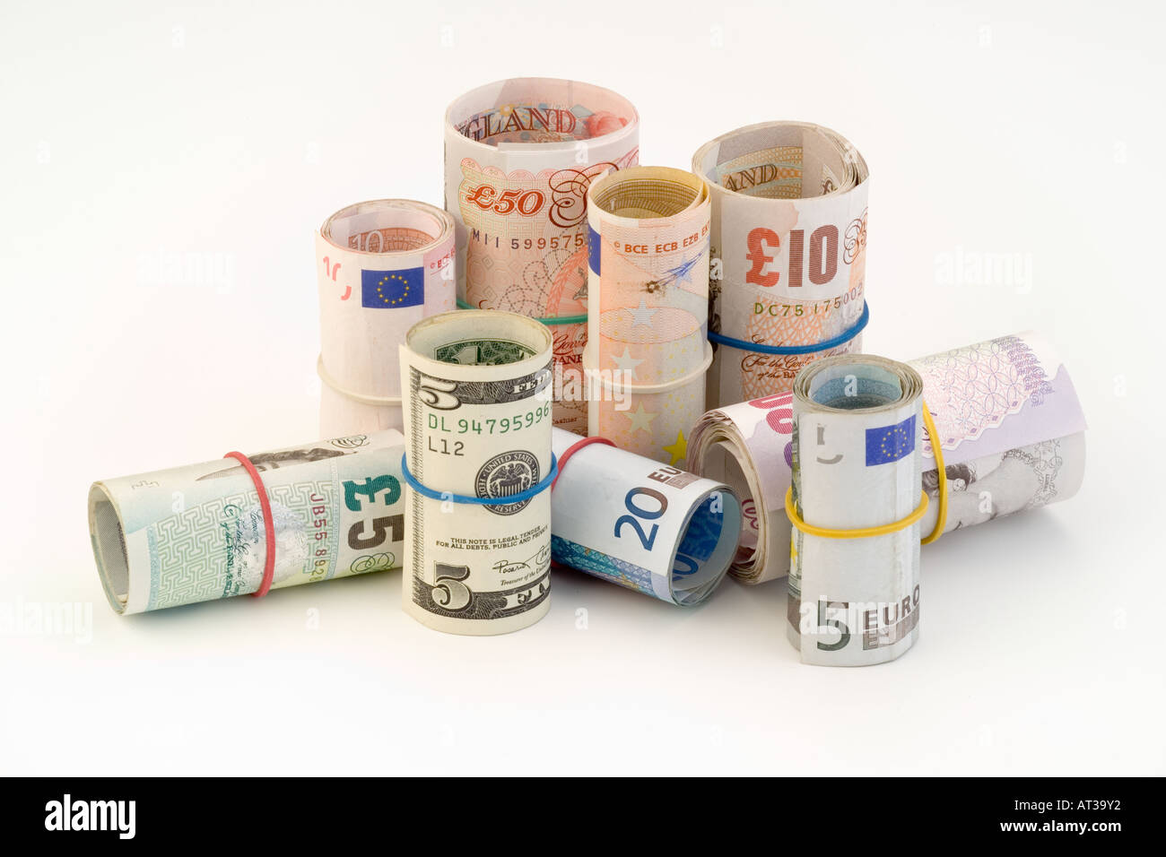 Rolls of world bank notes in a pile Stock Photo - Alamy