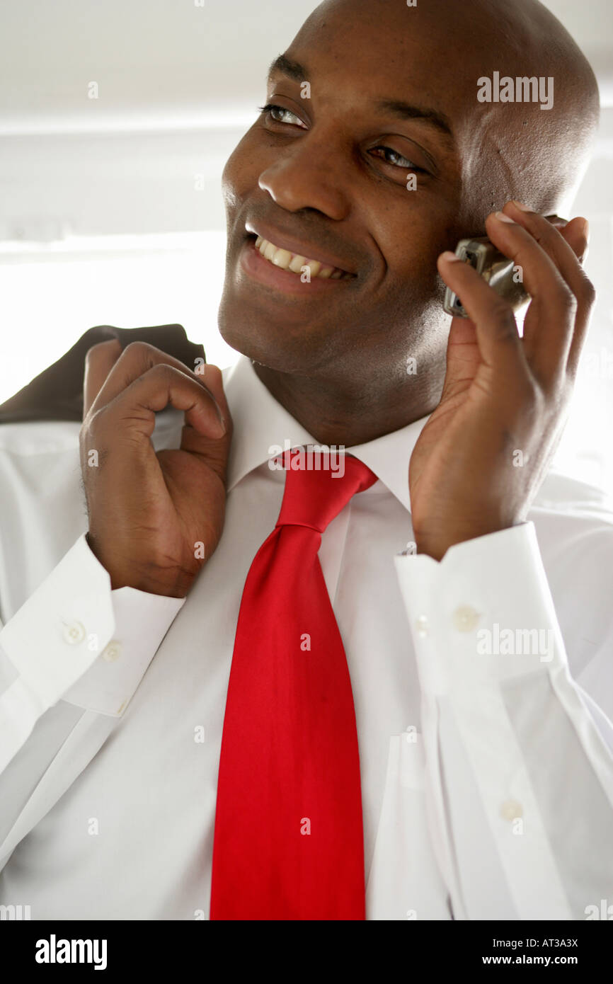 A business man jacket over shoulder, talking on a mobile phone Stock ...