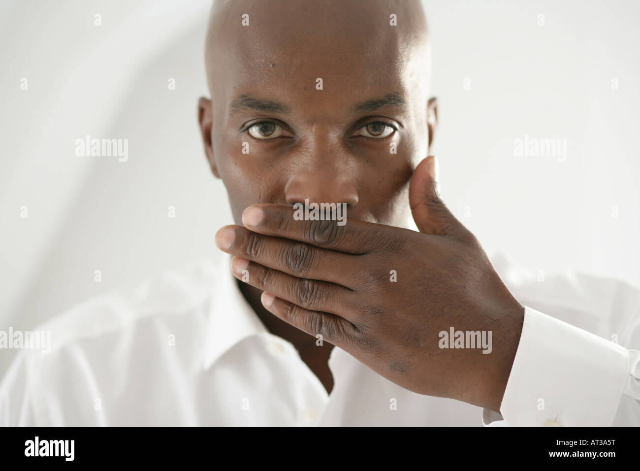 Hand over his mouth hi-res stock photography and images - Alamy