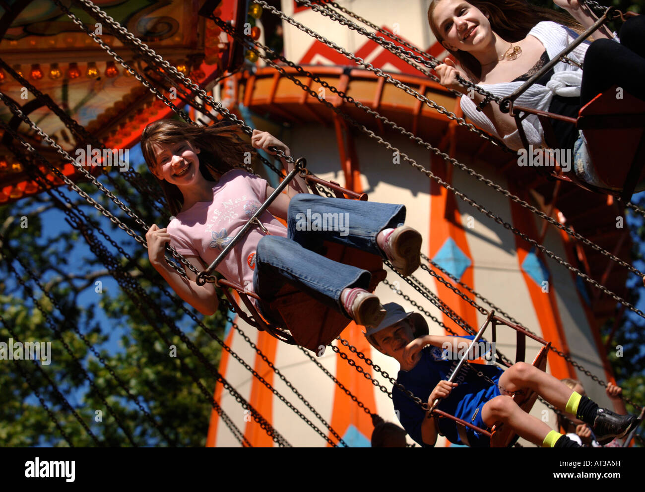 Girls riding merry go round hi-res stock photography and images - Alamy