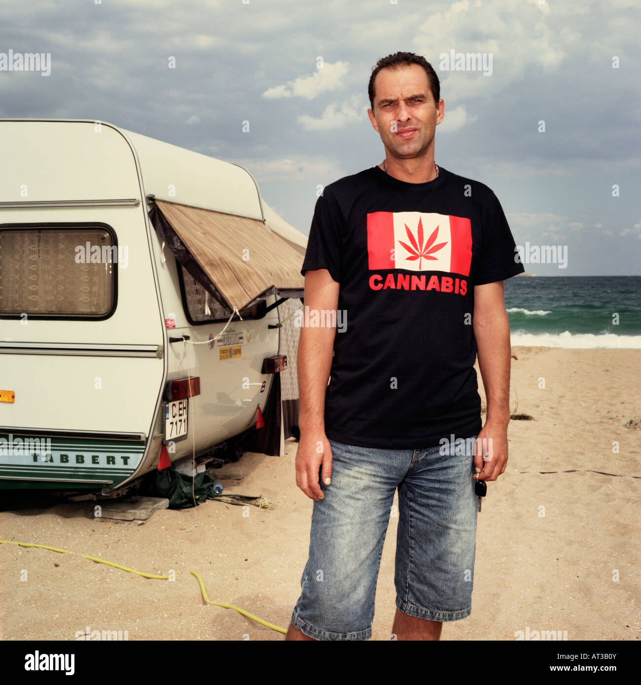 Man standing at a caravan park Stock Photo - Alamy