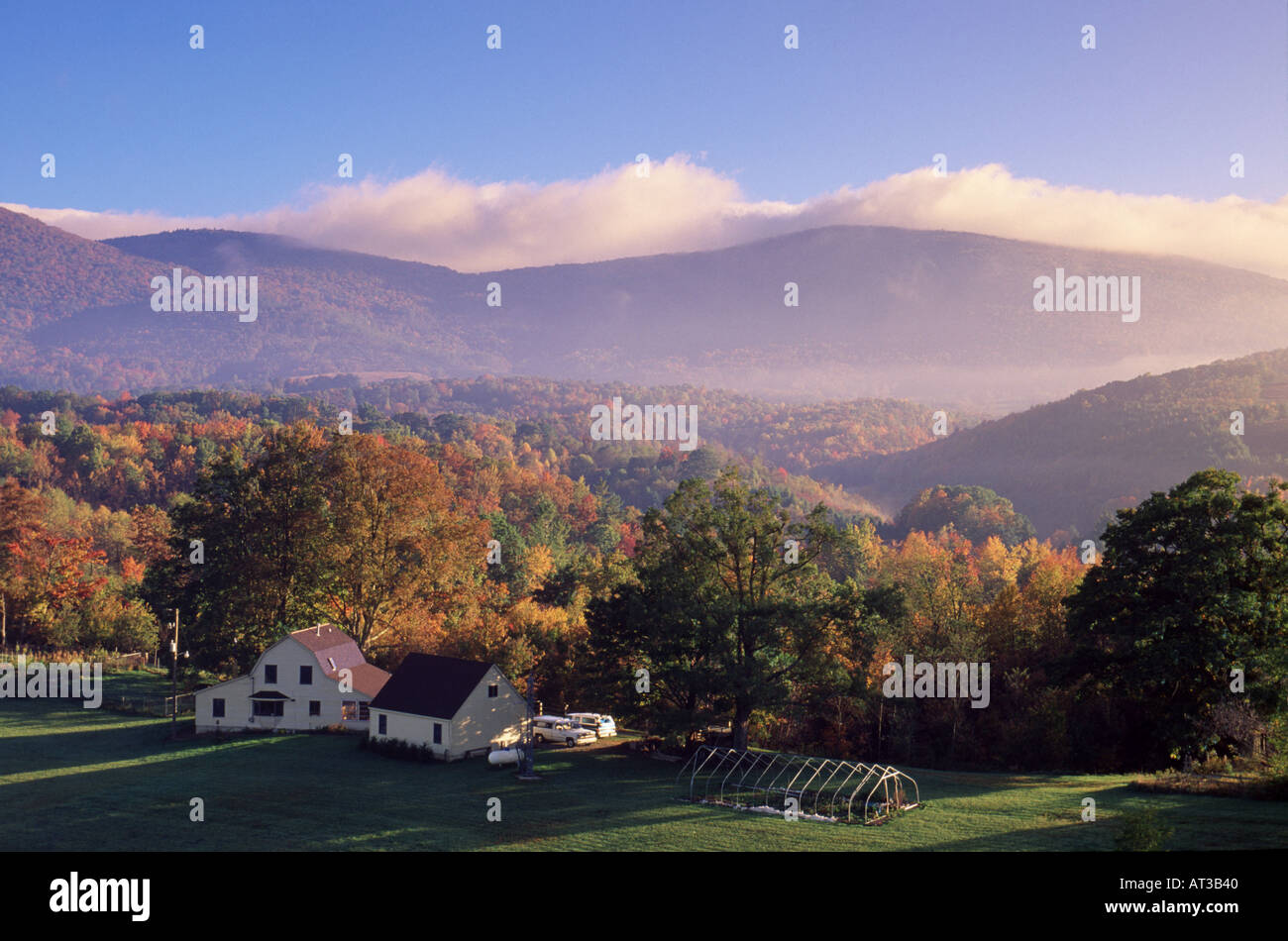Blue Ridge Mountain landscape in the fall with farm house nestled in ...