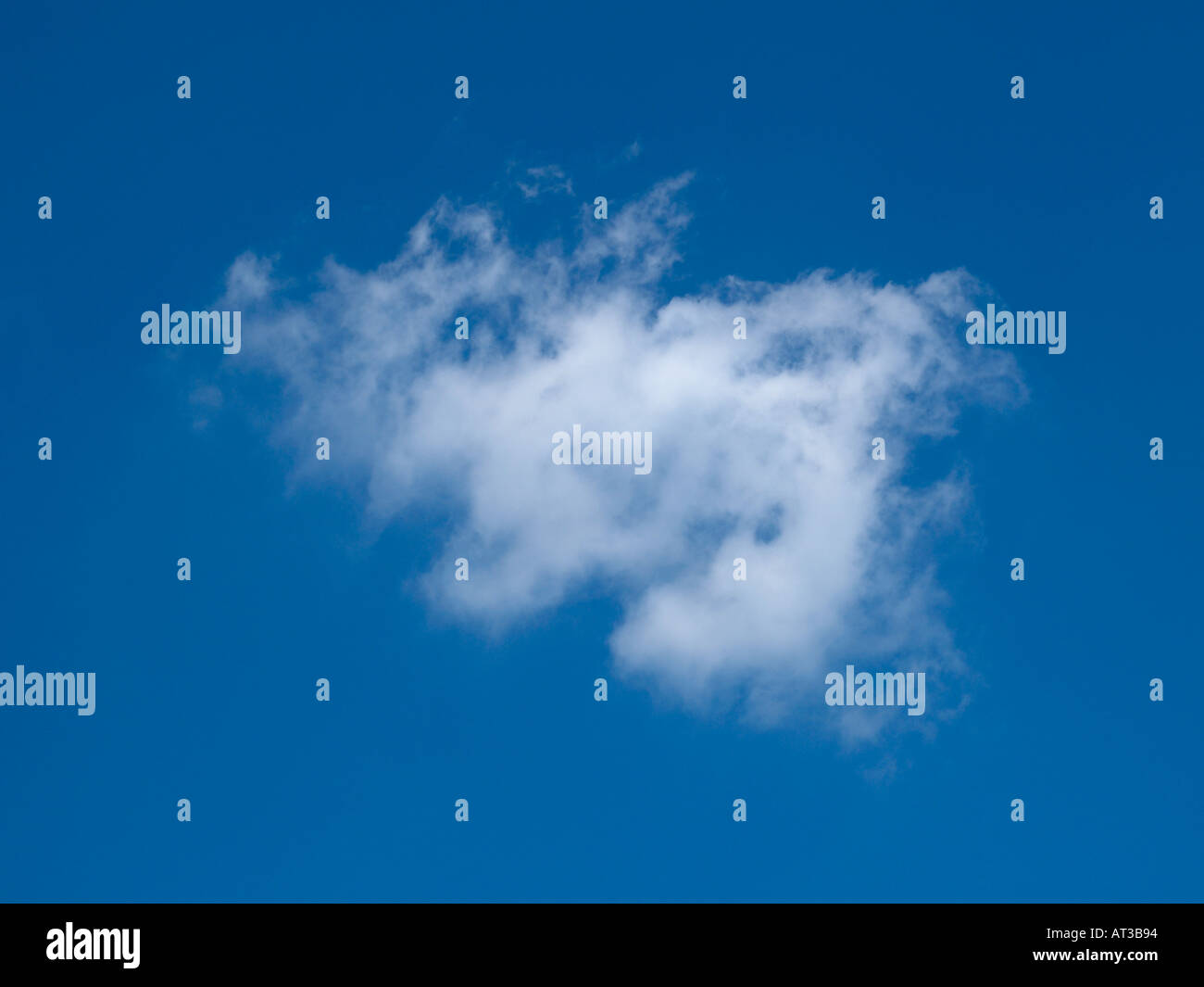 a beautiful single cloud in a blue sky Stock Photo - Alamy