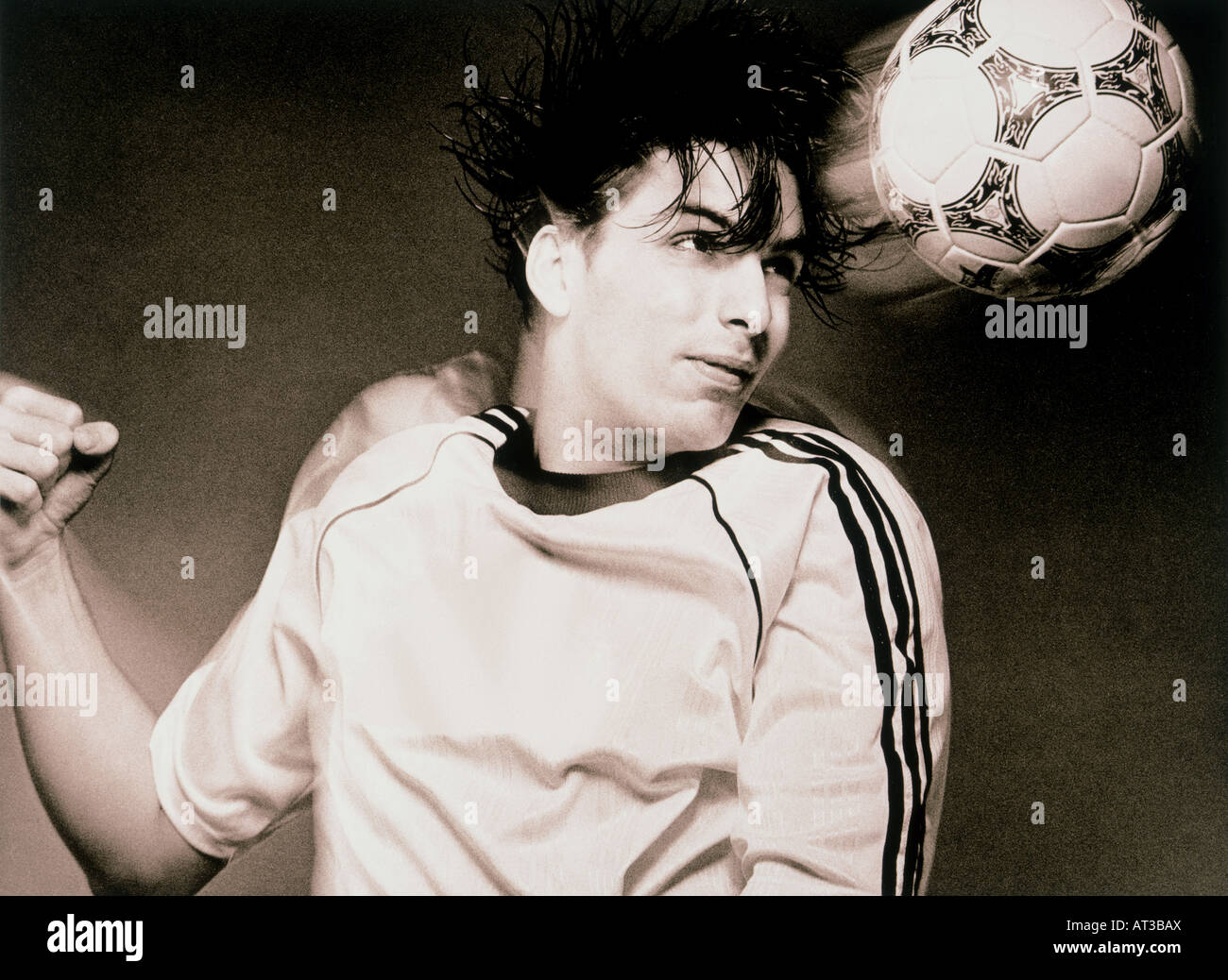 Footballer heading ball hi-res stock photography and images - Alamy