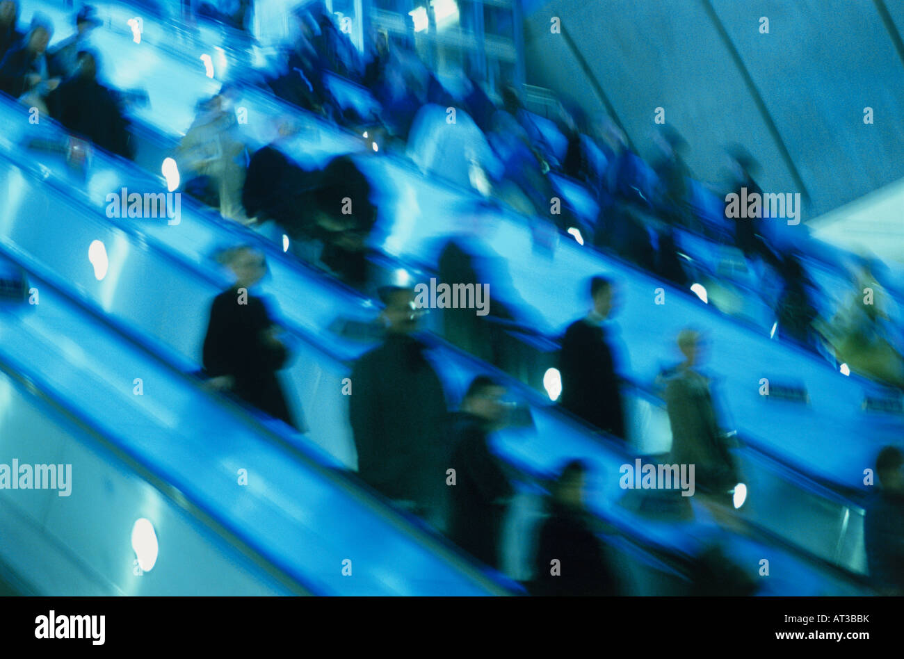 People on escalators Stock Photo - Alamy