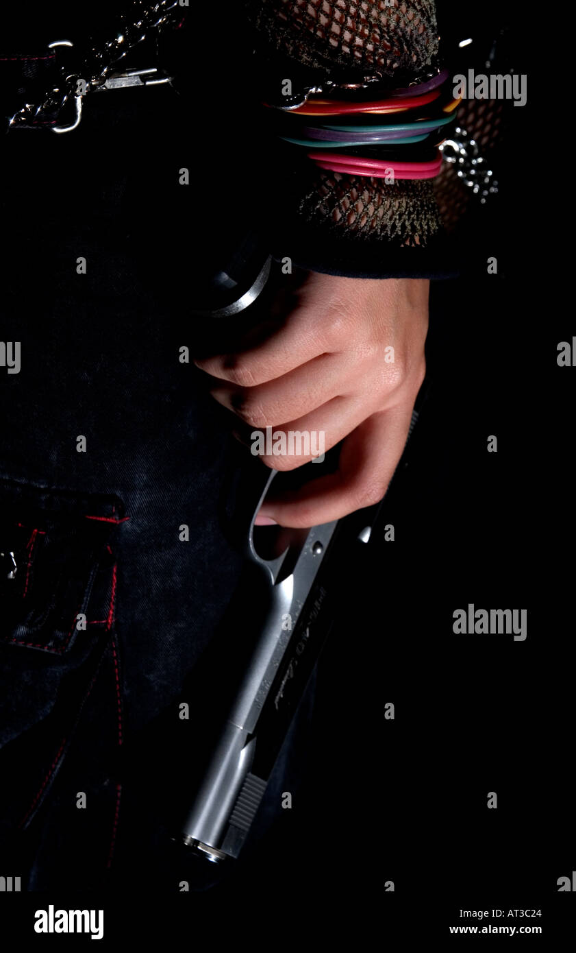 Girl holding guns hi-res stock photography and images - Alamy
