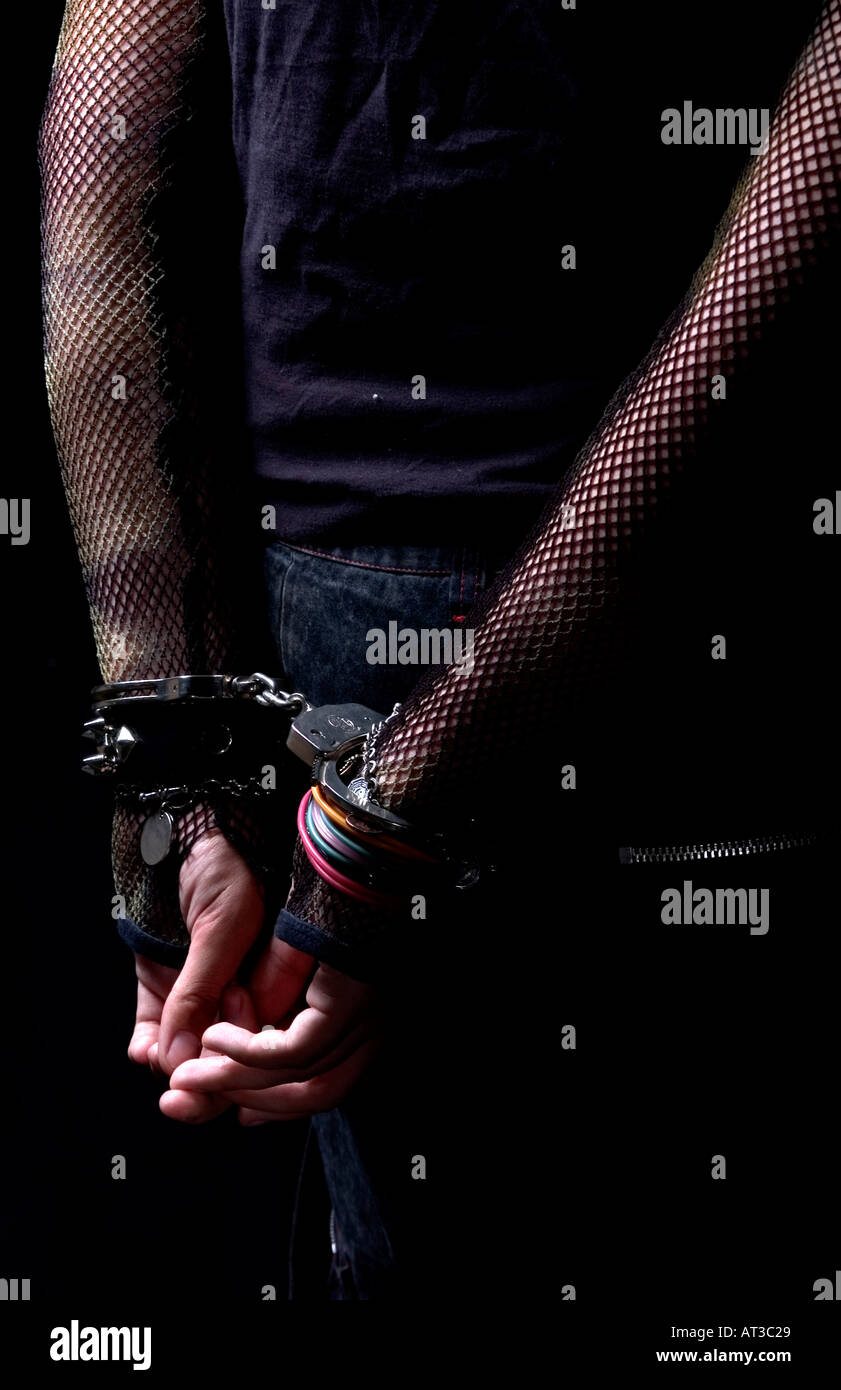 Close up of child with hands handcuffed behind back Stock Photo - Alamy