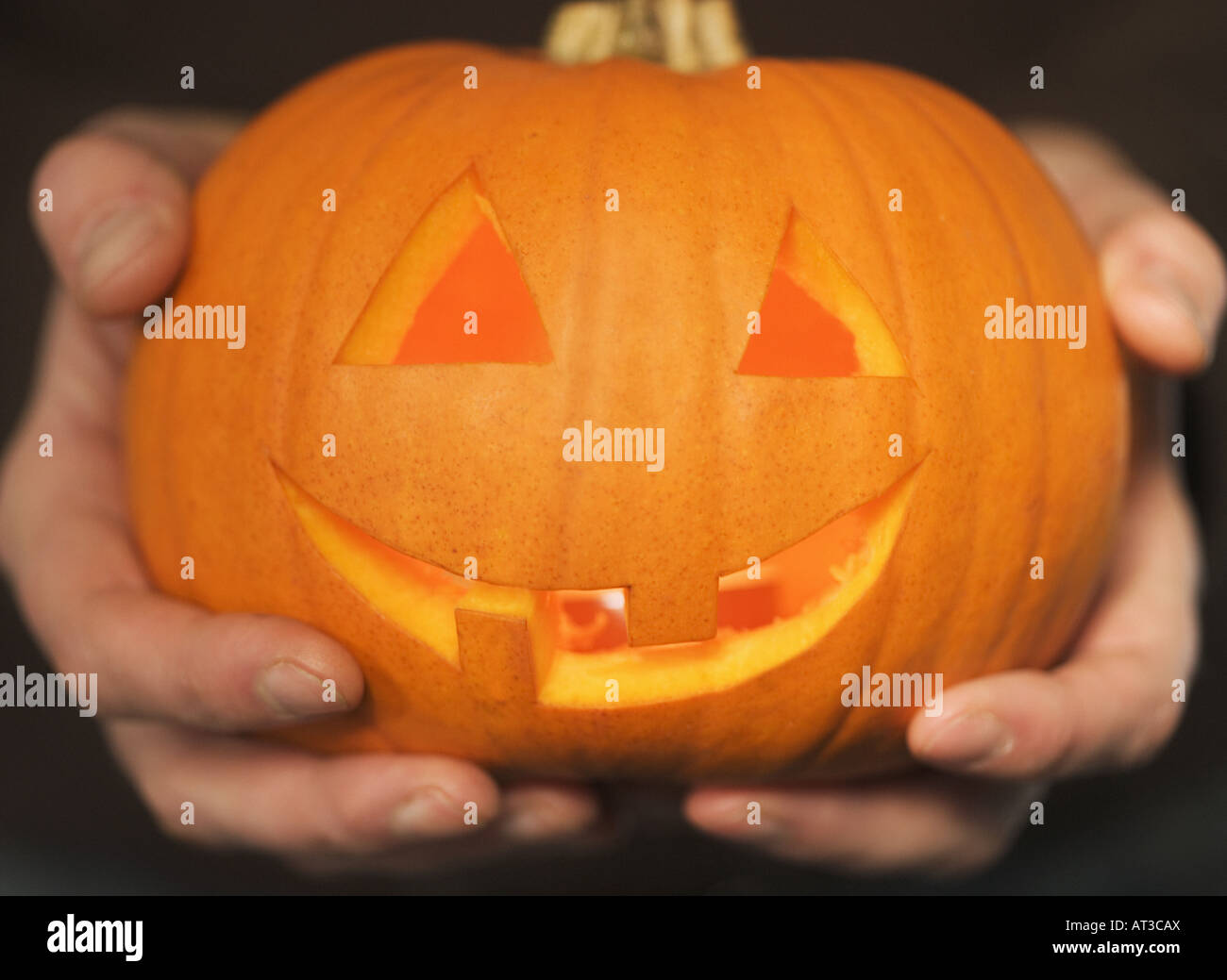 Hands holding a carved pumpkin Stock Photo - Alamy