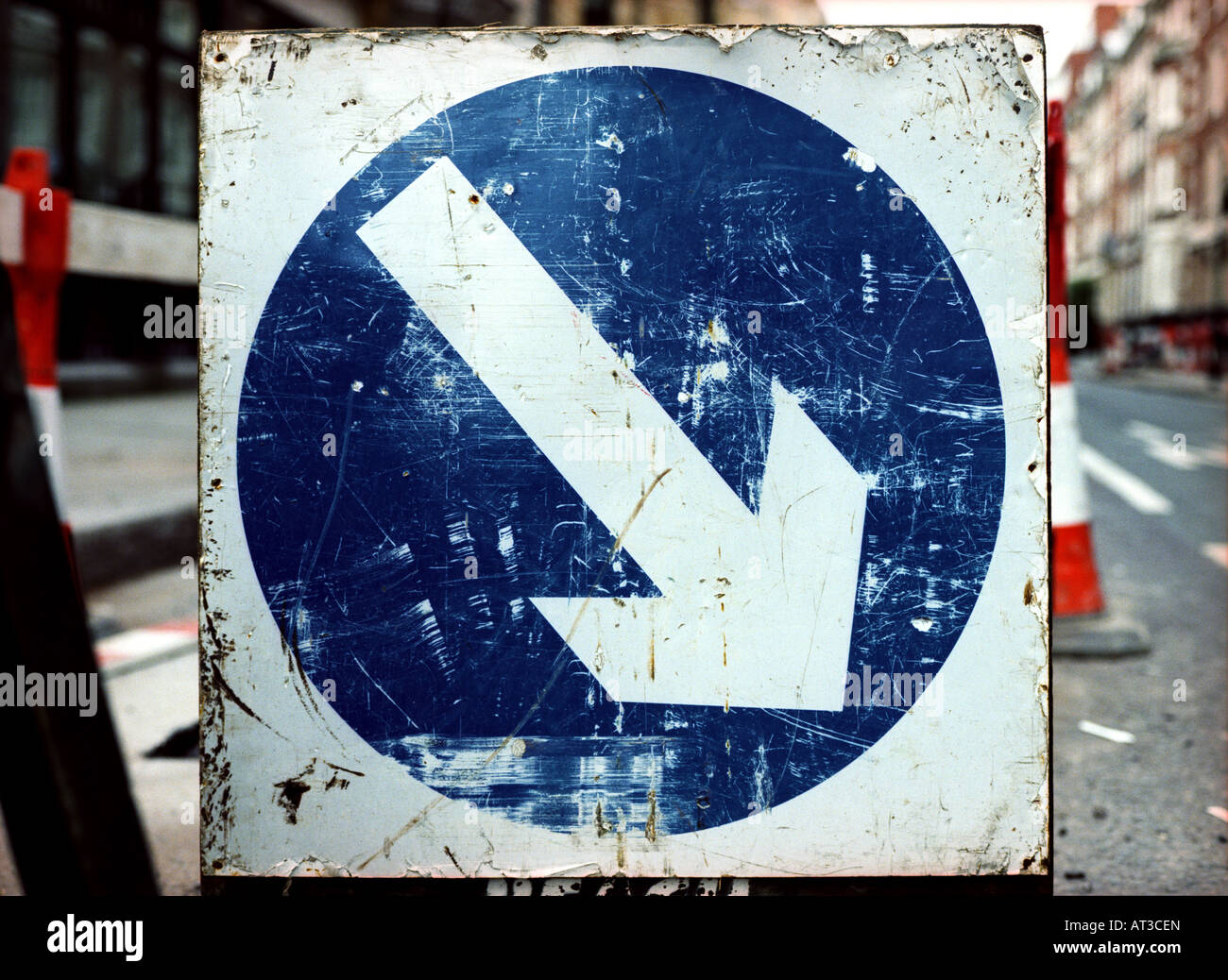 Road works, a battered arrow sign Stock Photo - Alamy