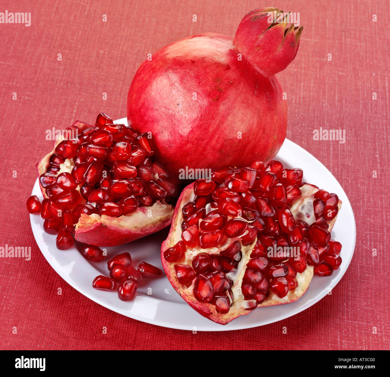 POMEGRANATES ON PLATE Stock Photo - Alamy