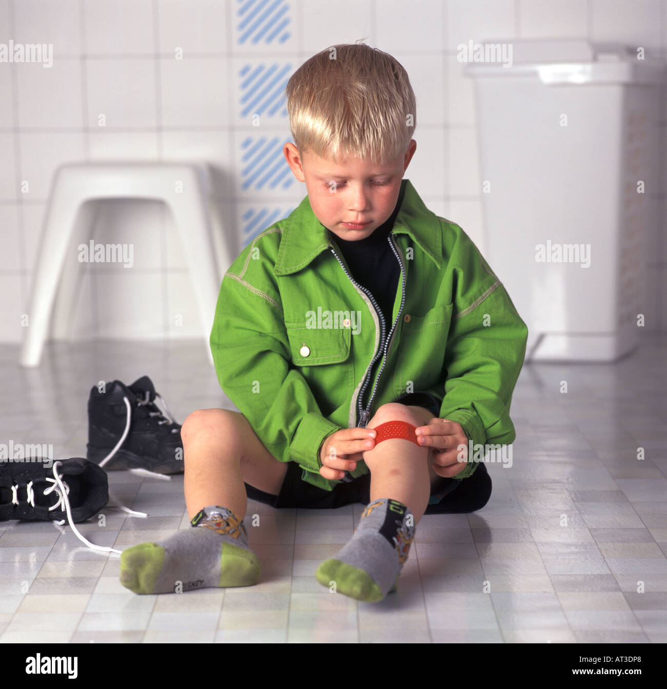 Boy plaster on knee hi-res stock photography and images - Alamy