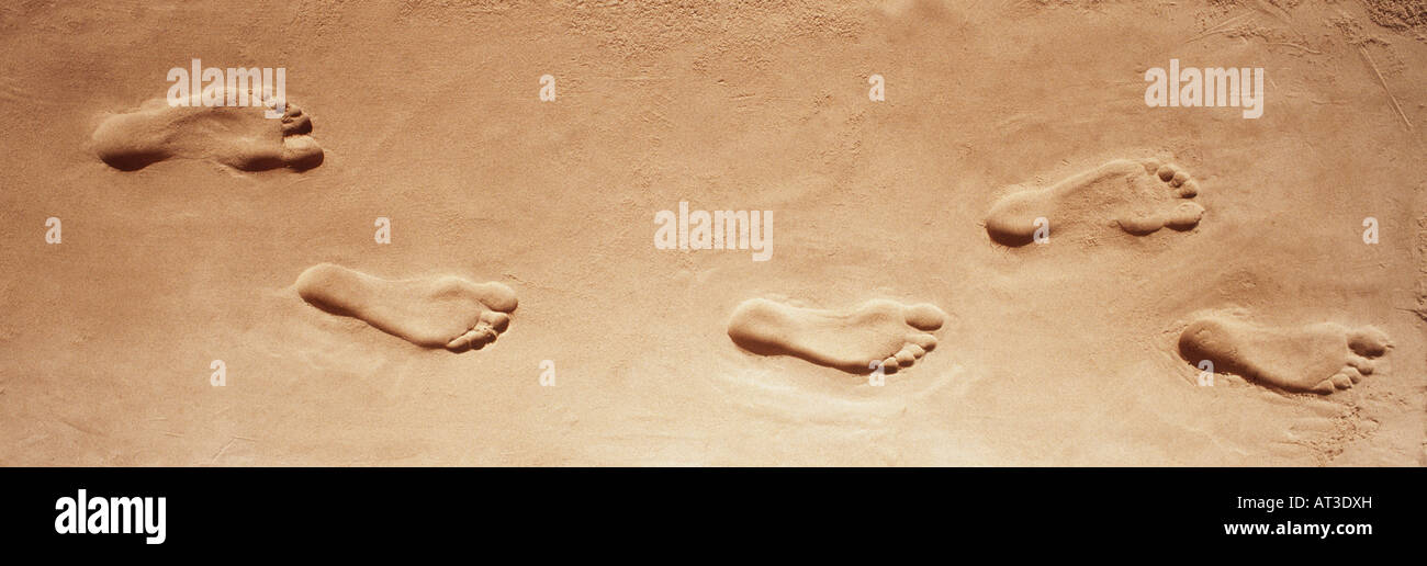 Footsteps in sand Stock Photo - Alamy