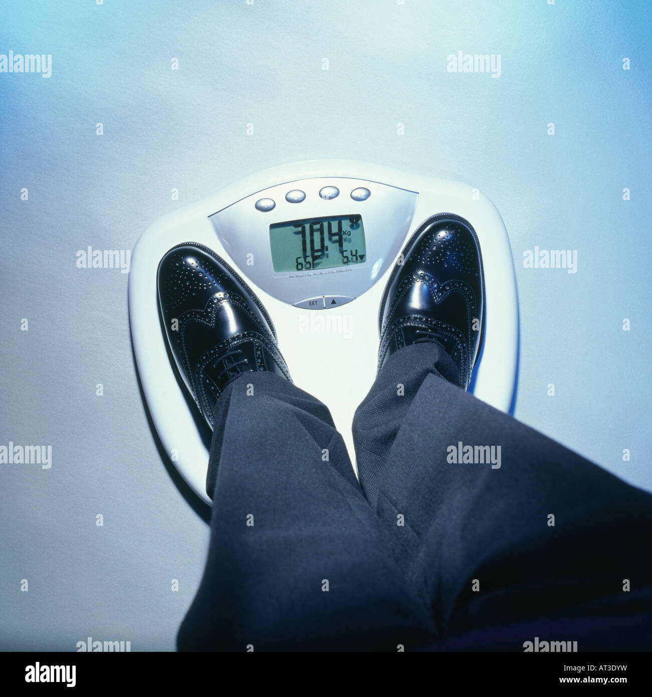 Man on scales hi-res stock photography and images - Alamy