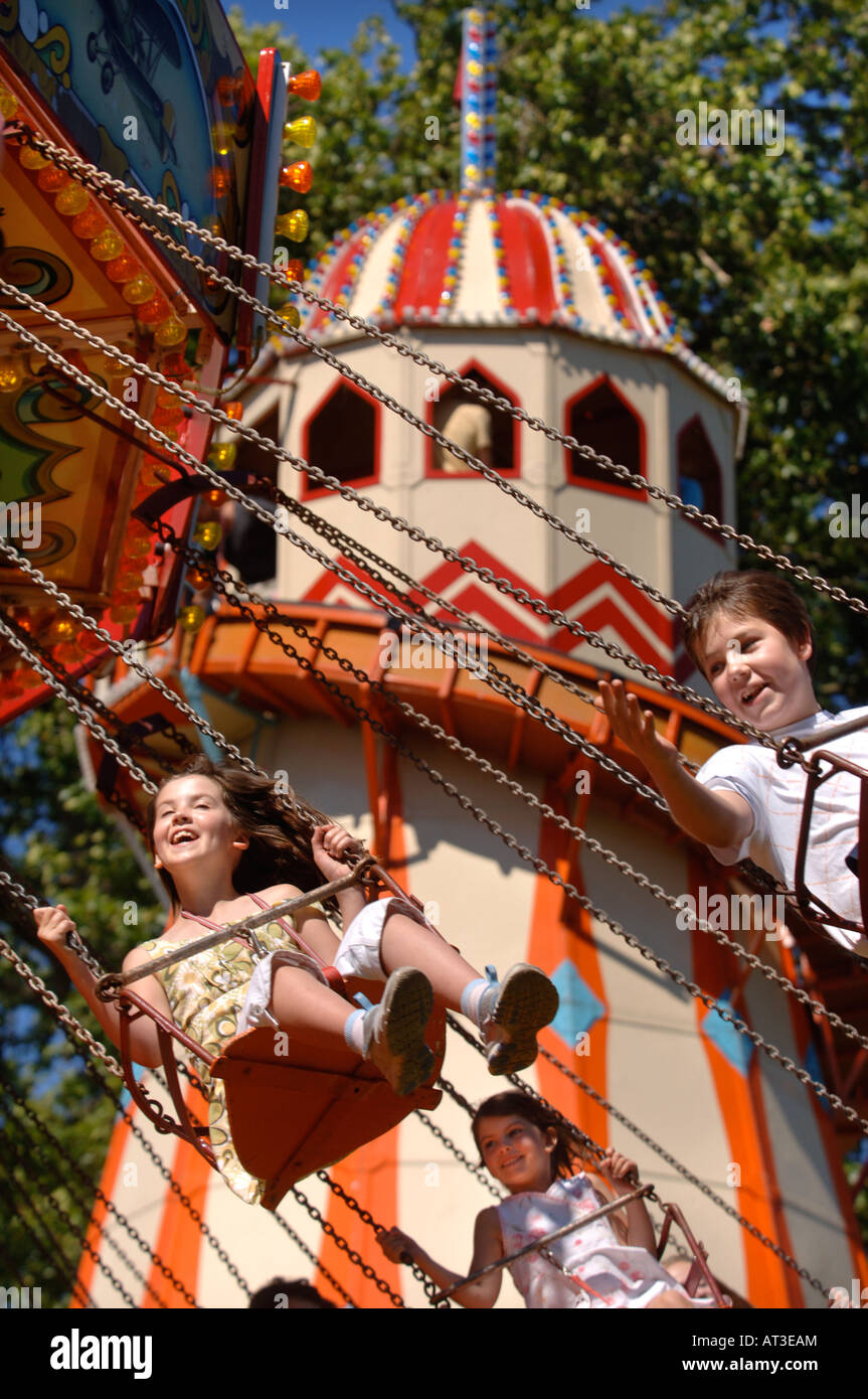 Girls riding merry go round hi-res stock photography and images - Alamy