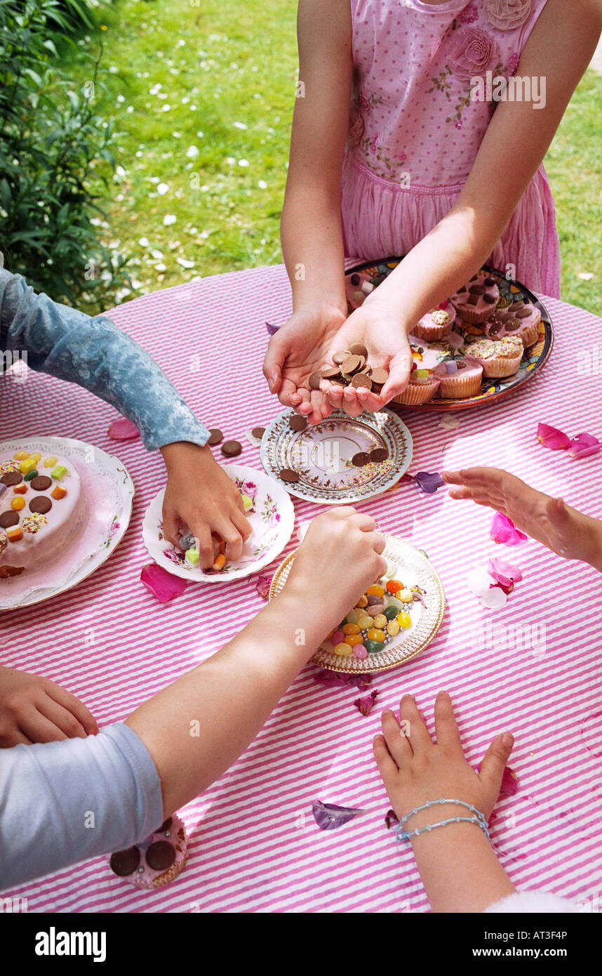 Children decorating cakes with small sweets Stock Photo - Alamy