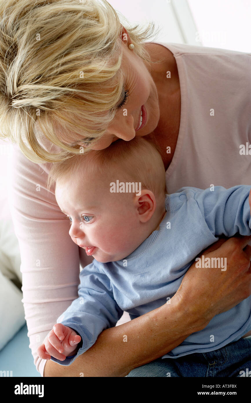 Grandmother cuddling baby, close-up Stock Photo - Alamy