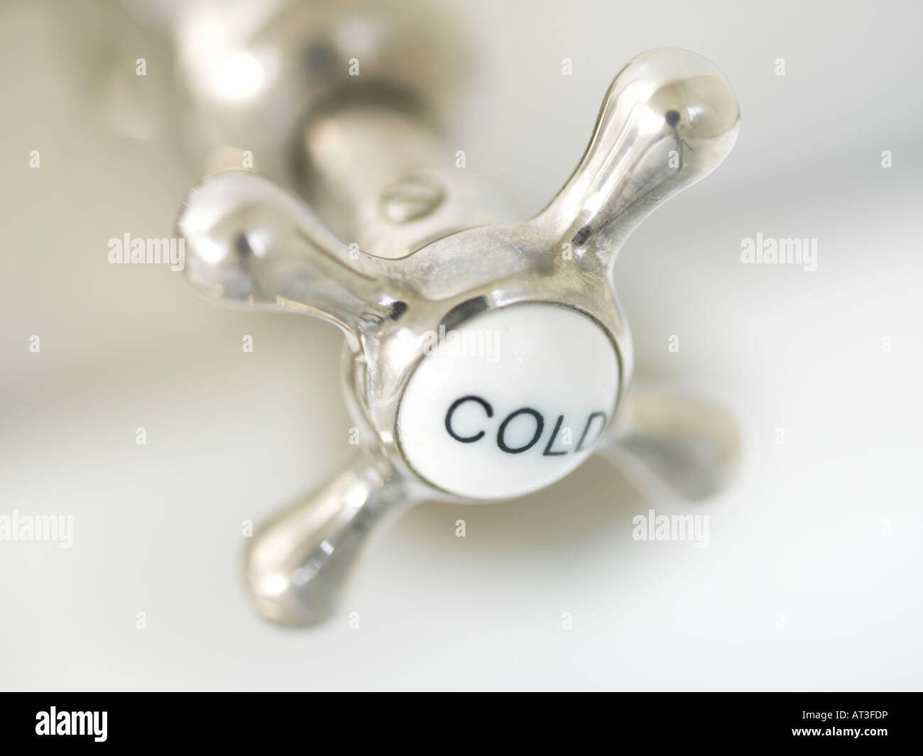 The top of a tap marked "cold Stock Photo - Alamy