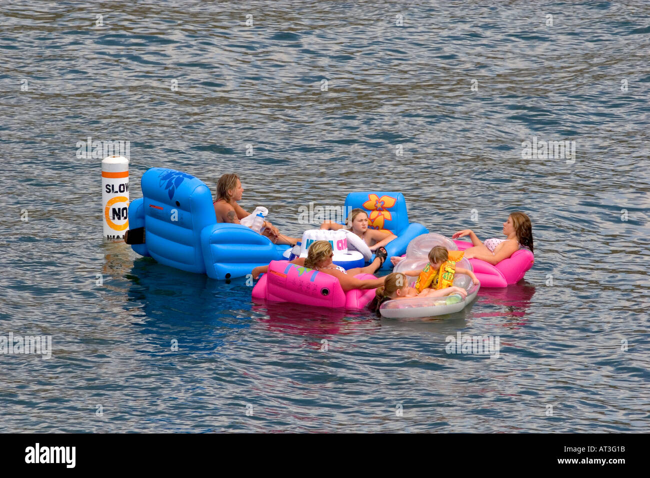 People float on inflatable water toys at Lucky Peak Reservior near ...