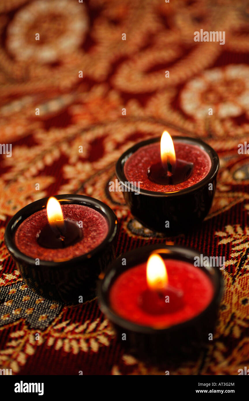 Three red candles burning Stock Photo - Alamy