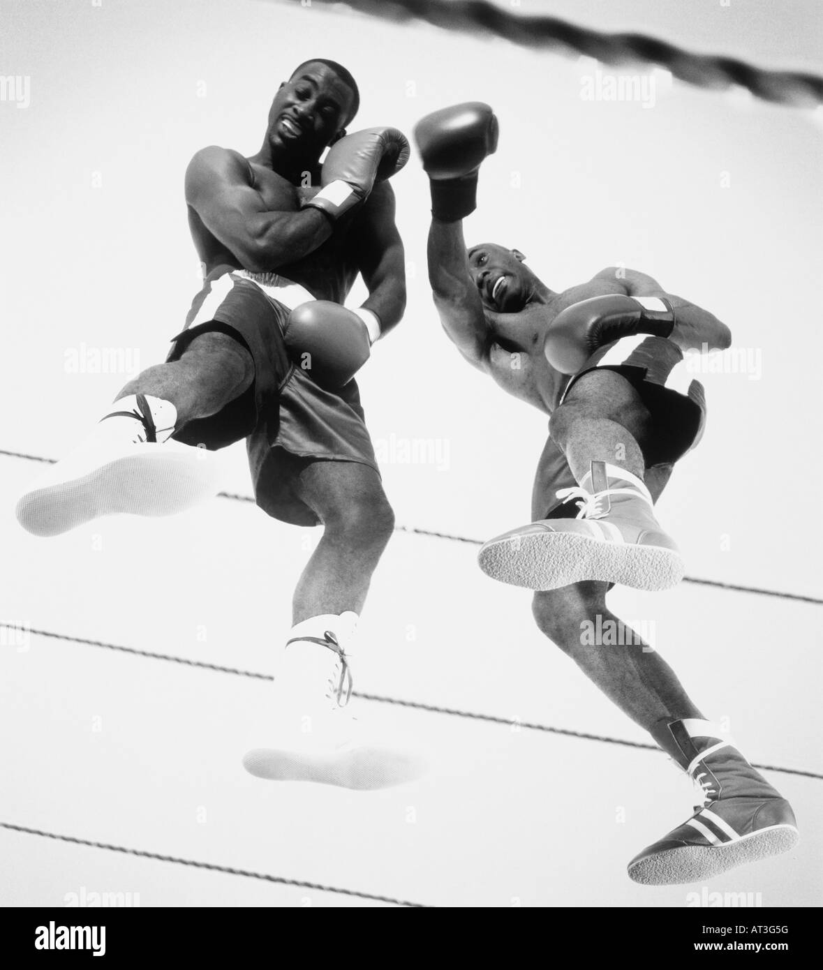 Two boxers fighting in a ring Stock Photo - Alamy