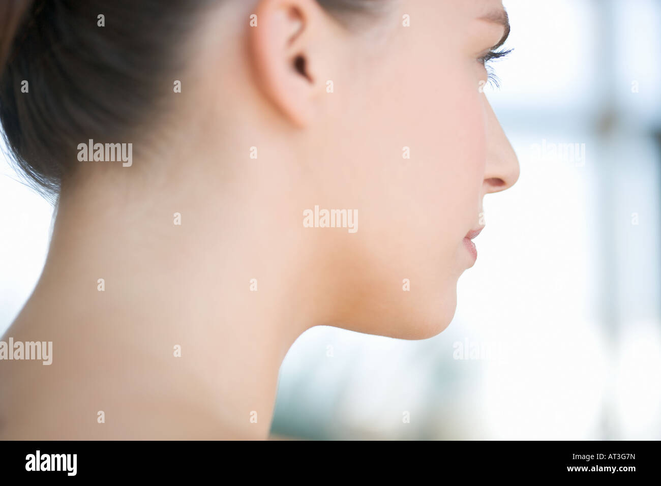 Young woman's face and neck, side view Stock Photo - Alamy