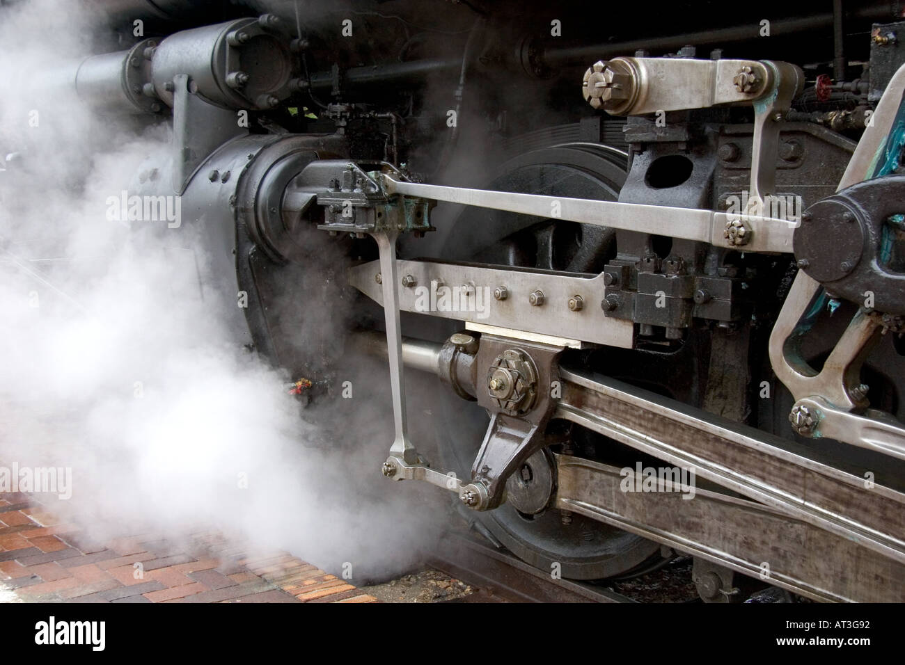 Close view of historic Challenger locomotive steam engine. Drive wheels ...