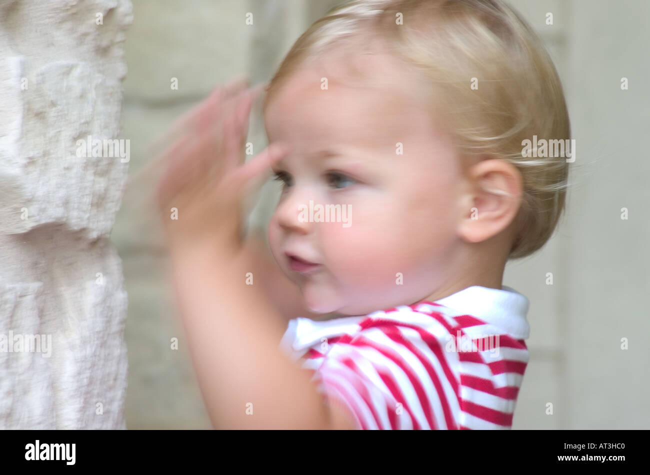 Patting the Wall Stock Photo - Alamy