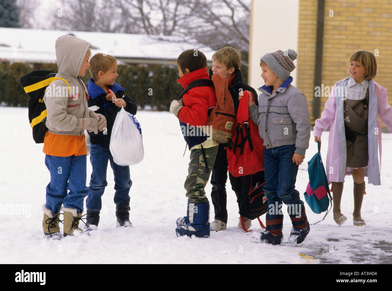 Children dressed for cold weather and snow Stock Photo - Alamy