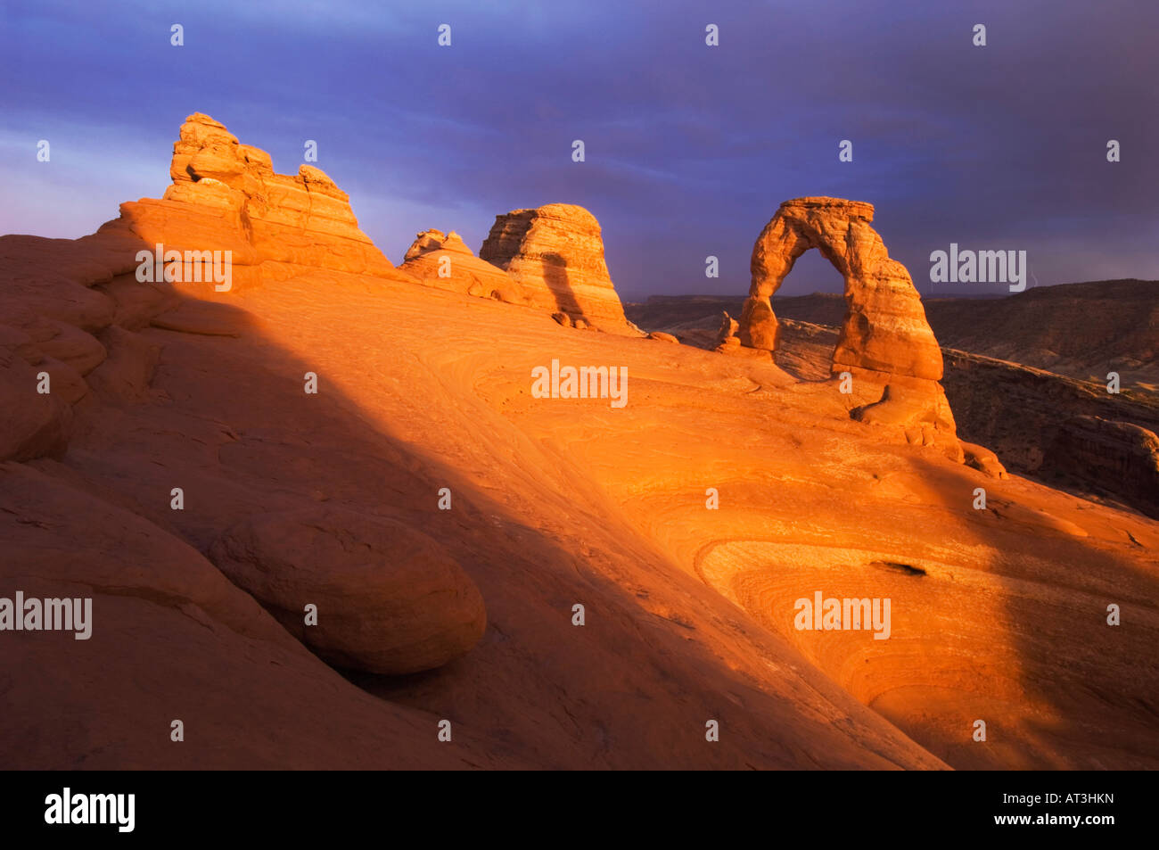 Delicate Arch at sunset with lightning strikes Arches National Park ...
