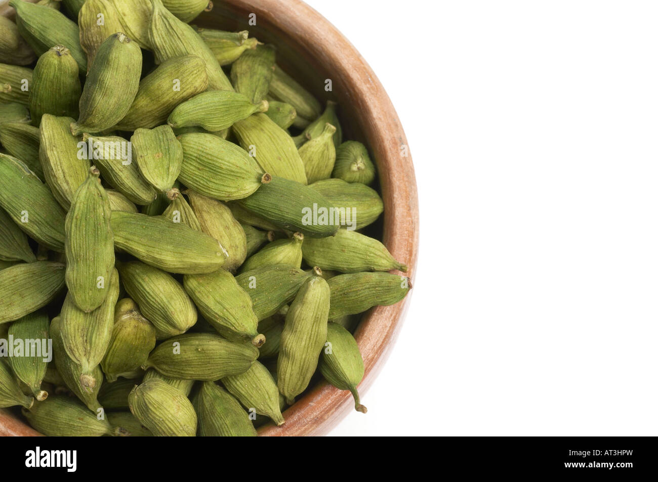 Green cardamom pods in bowl hi-res stock photography and images - Alamy