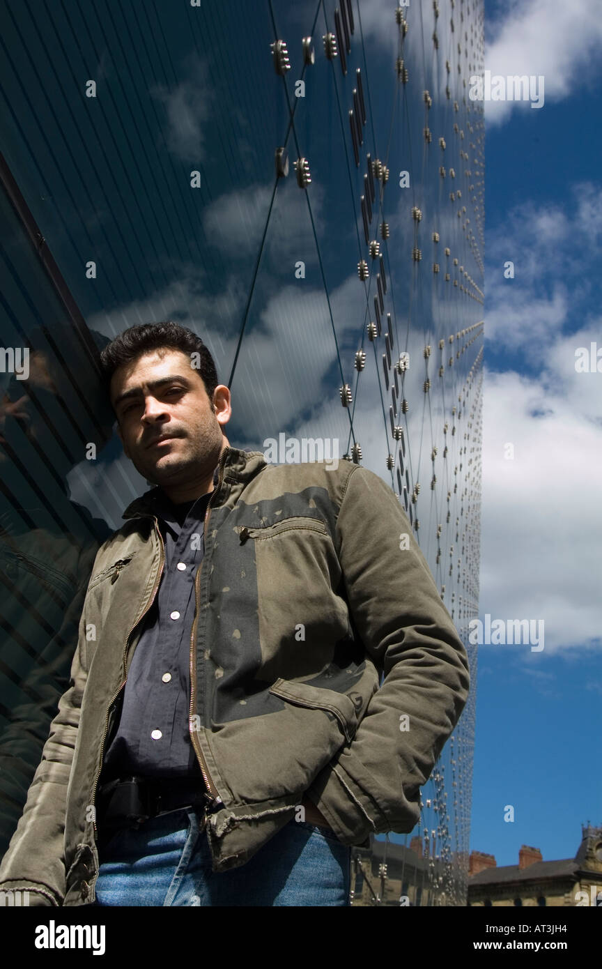 man next to building Stock Photo - Alamy