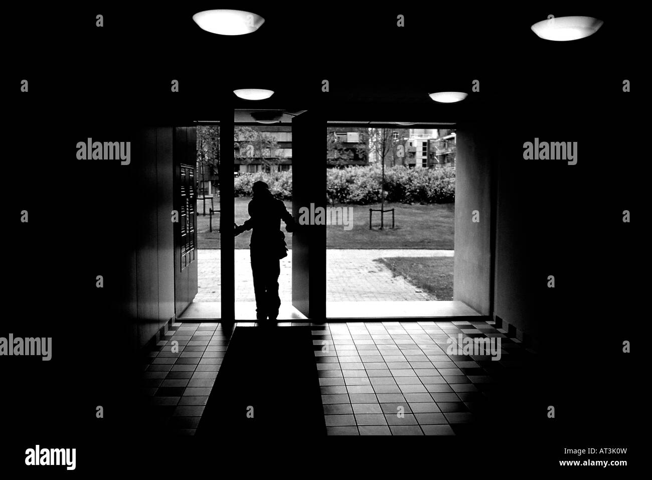 Man leaving house Black and White Stock Photos & Images - Alamy