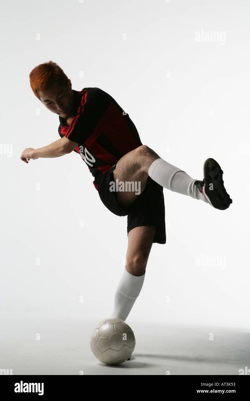 Soccer player shooting Stock Photo - Alamy