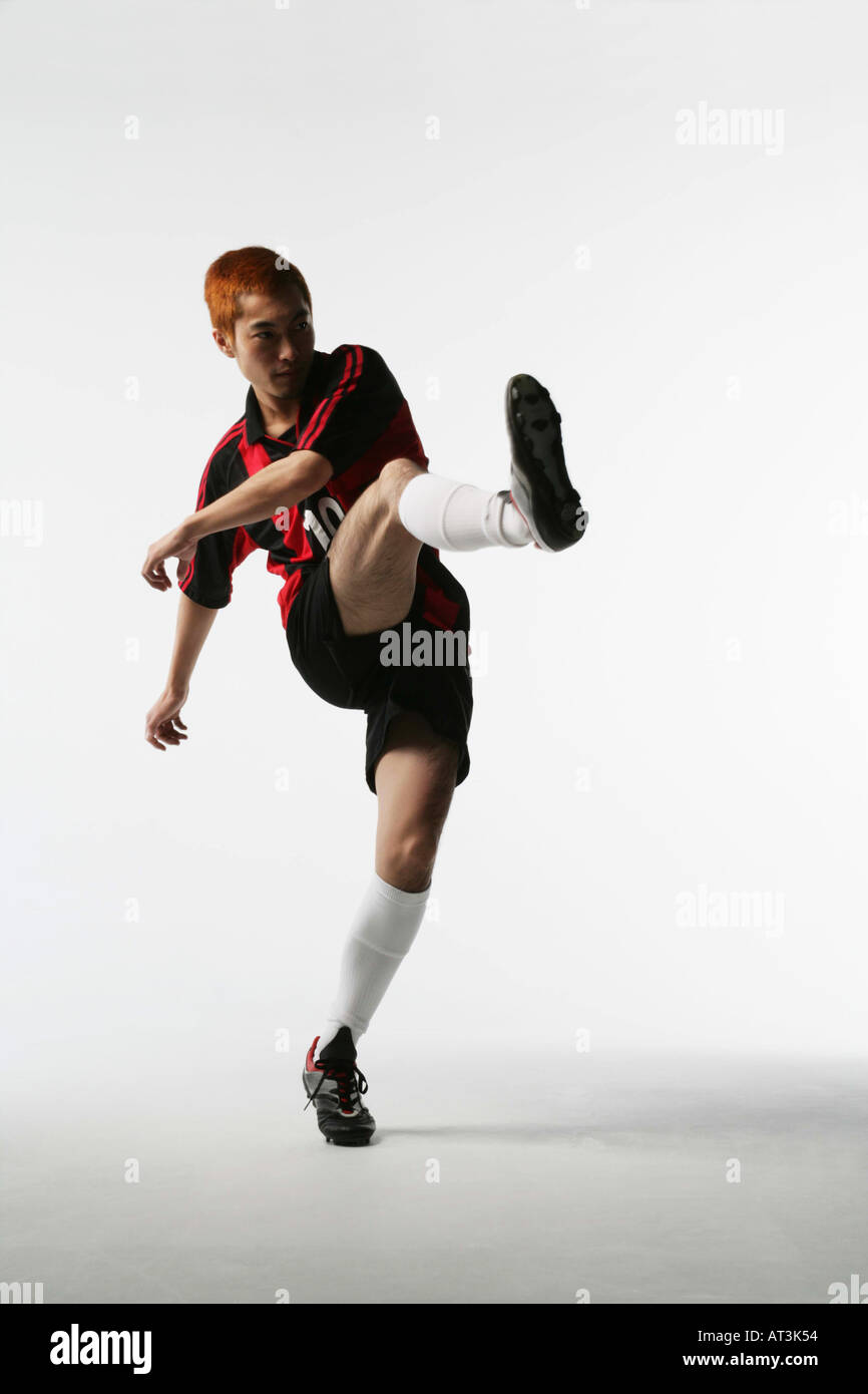 Soccer player shooting Stock Photo - Alamy