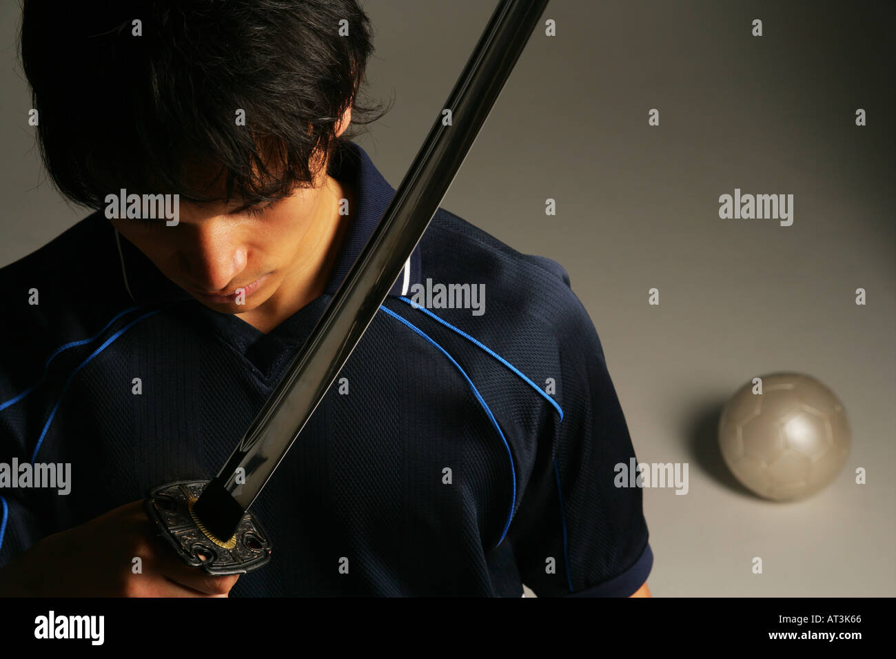 Soccer player with Japanese sword Stock Photo - Alamy